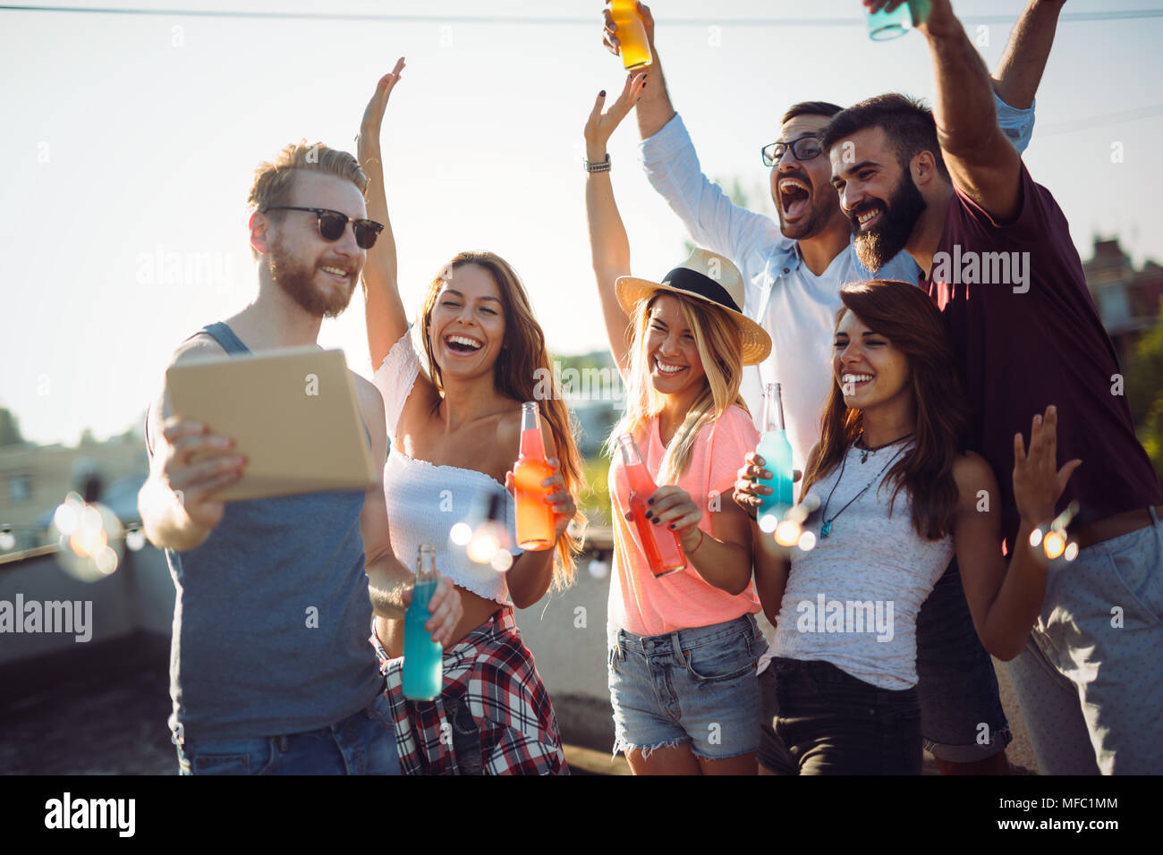 Group of friends enjoying party Stock Photo - Alamy