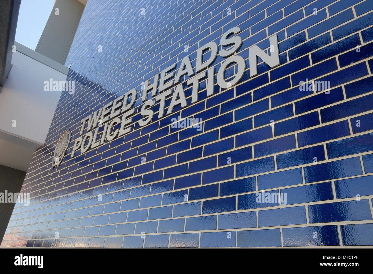 front of new Tweed Heads Police Station including sign on tiled wall ...