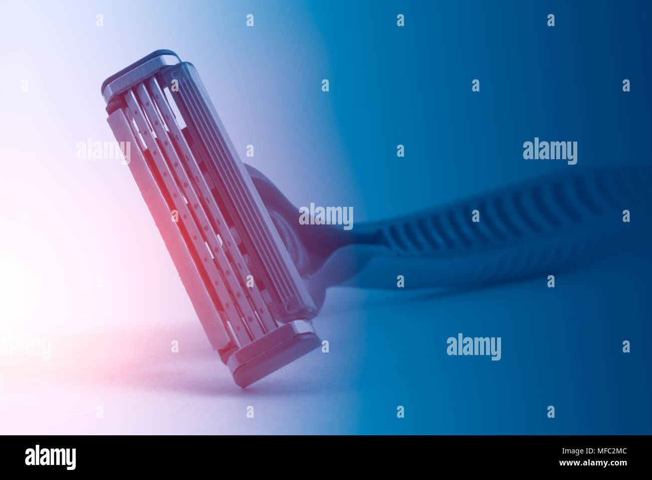 Men razor blur color tone with light effect Stock Photo - Alamy