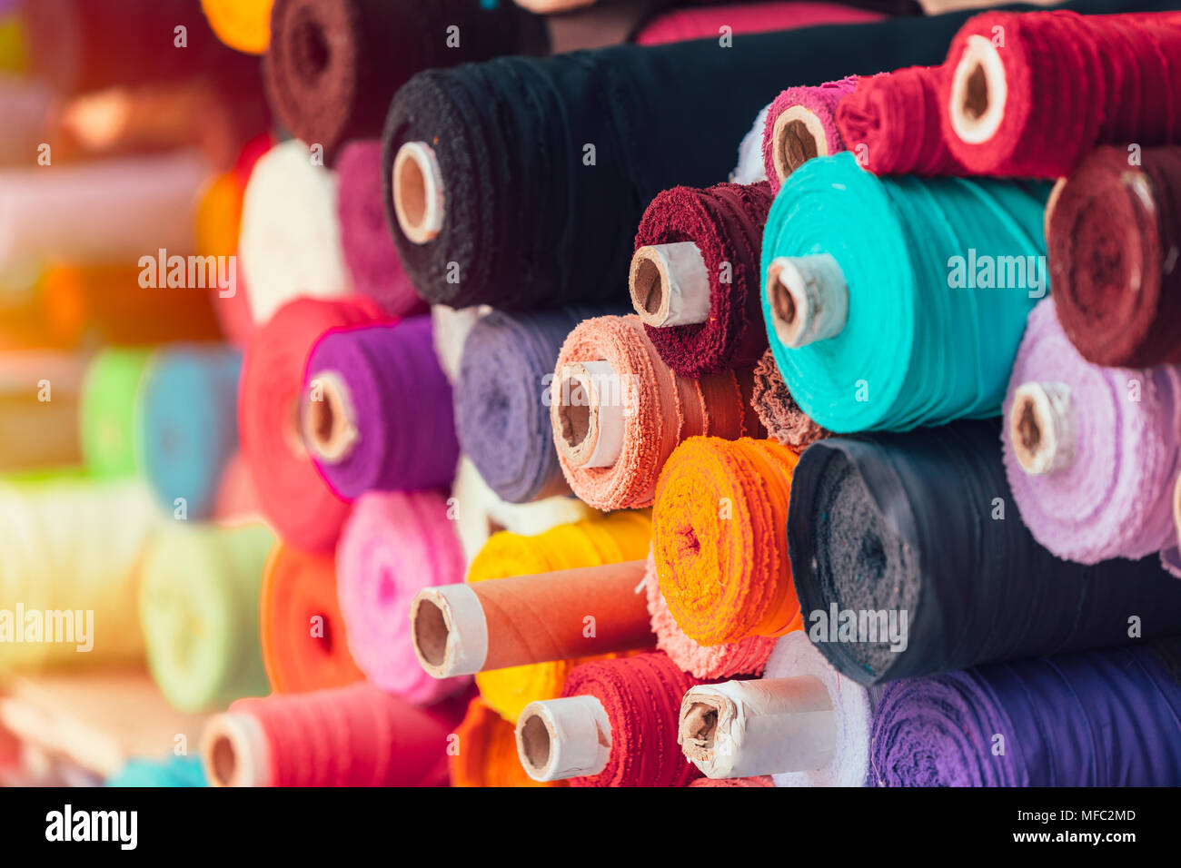 colorsful fabric silk rolls in textile shop industry from india Stock ...