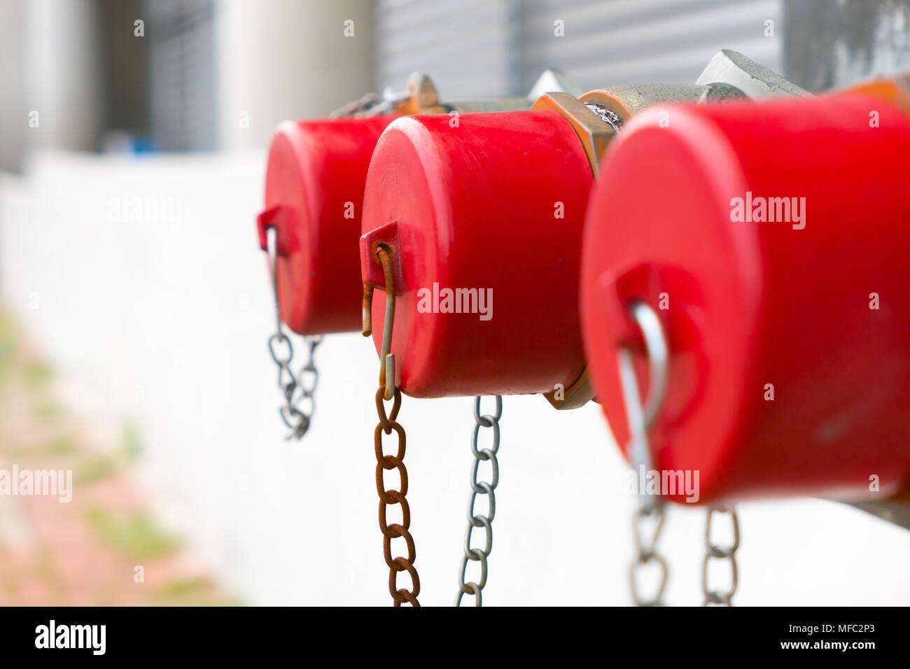 row fire hydrant closeup red cap Stock Photo - Alamy