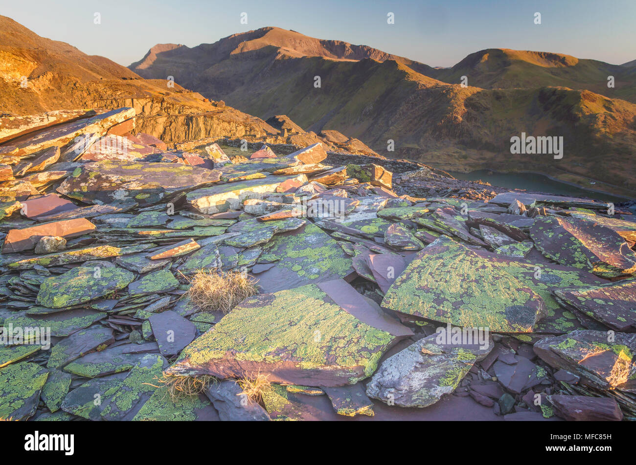 Snow don mountain range shot from dinorwic slate quarry Stock Photo - Alamy