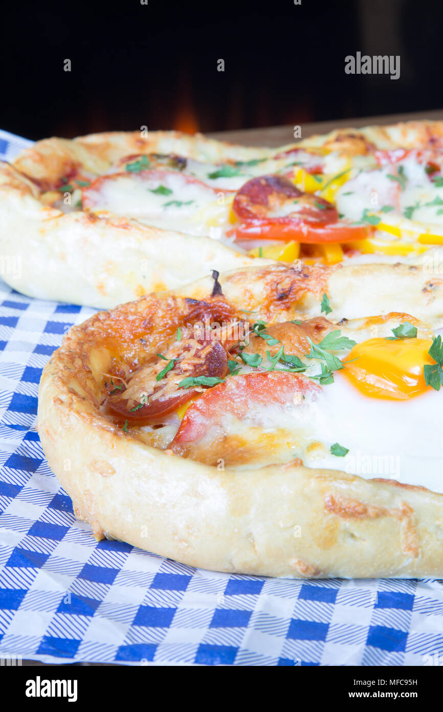 Handmade Turkish flat breads with cheese, tomato and egg. Yumurtali ...