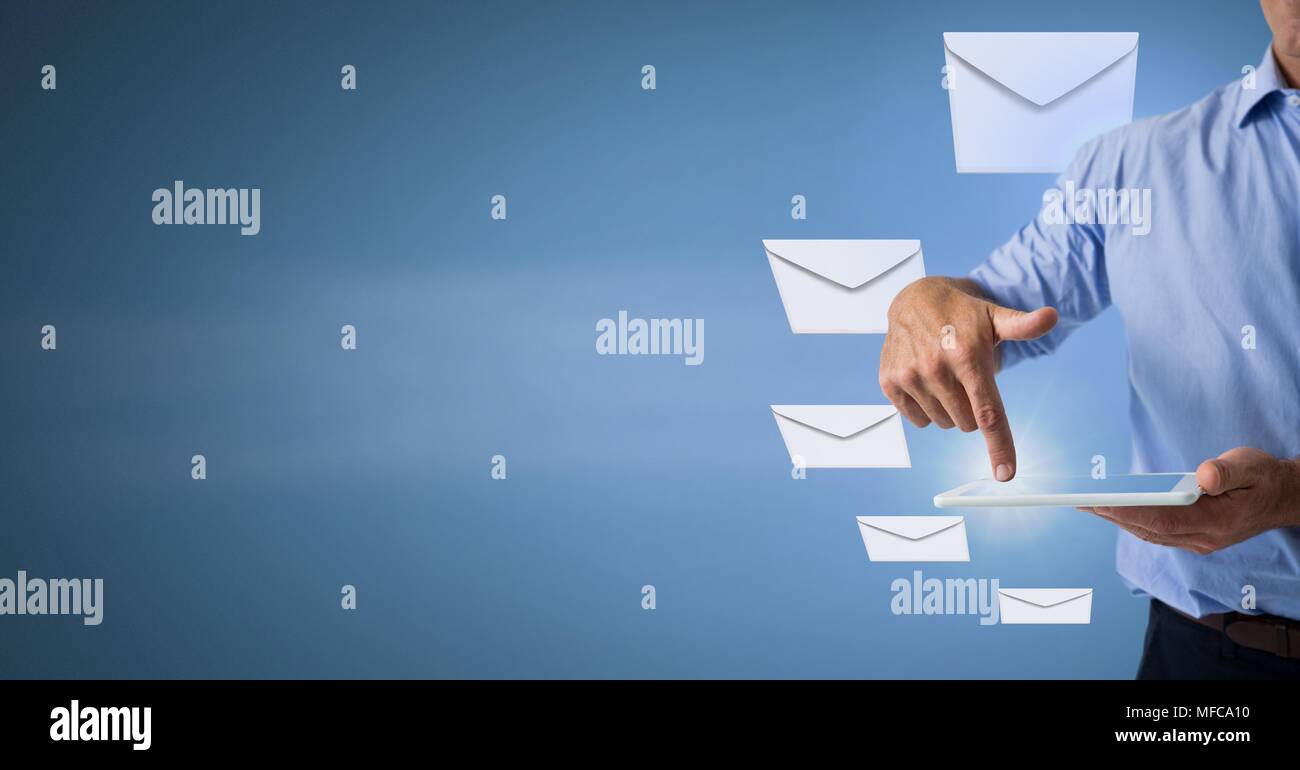 Envelope letter messages and man using tablet Stock Photo - Alamy