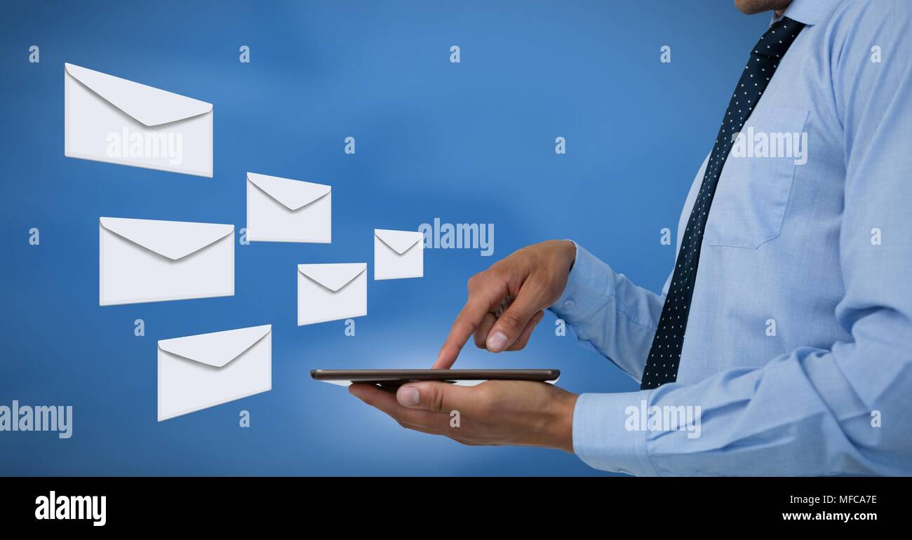 Envelope letter messages and man using tablet Stock Photo - Alamy