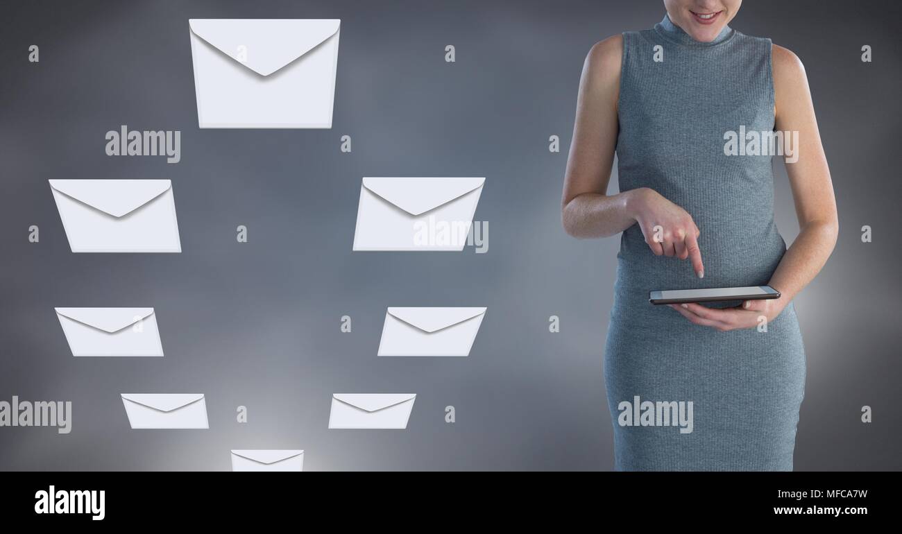 Envelope letter messages and woman using tablet Stock Photo - Alamy