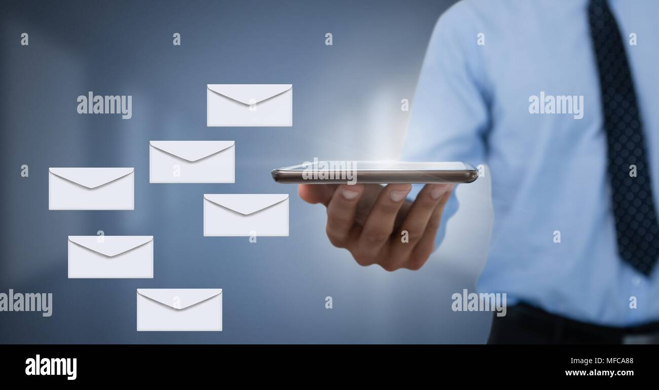 Envelope letter messages and man using tablet Stock Photo - Alamy