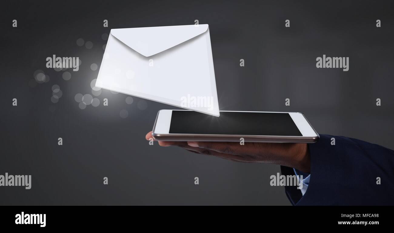 Envelope letter message and man using tablet Stock Photo - Alamy