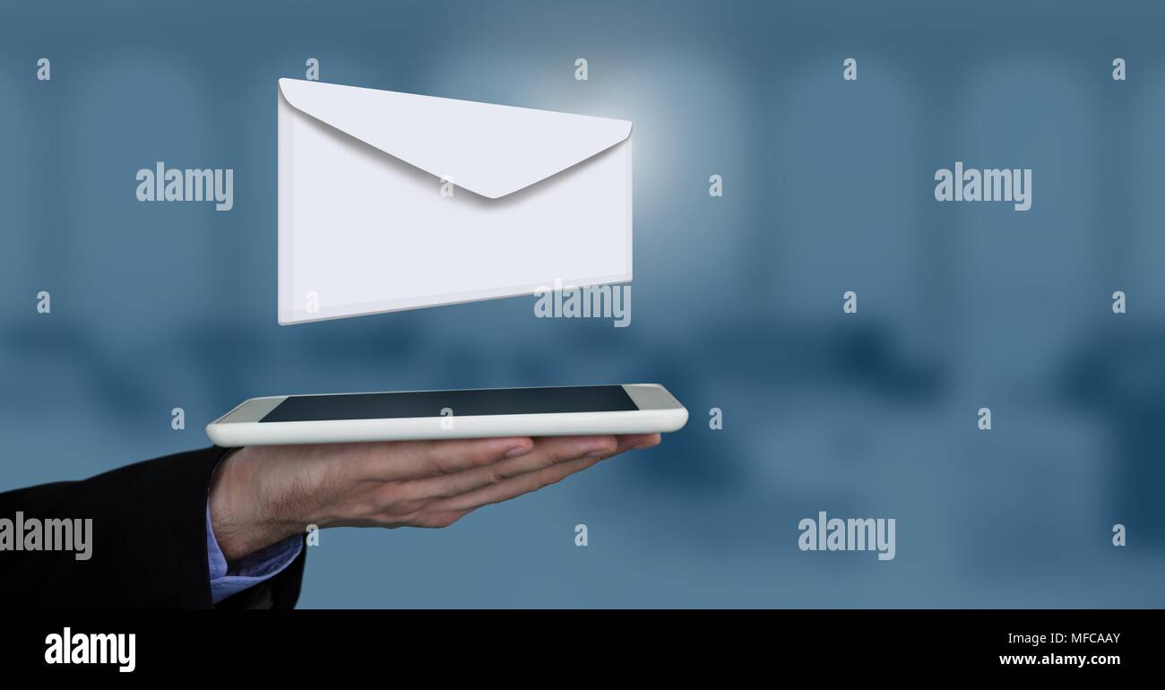 Envelope letter message and man using tablet Stock Photo - Alamy