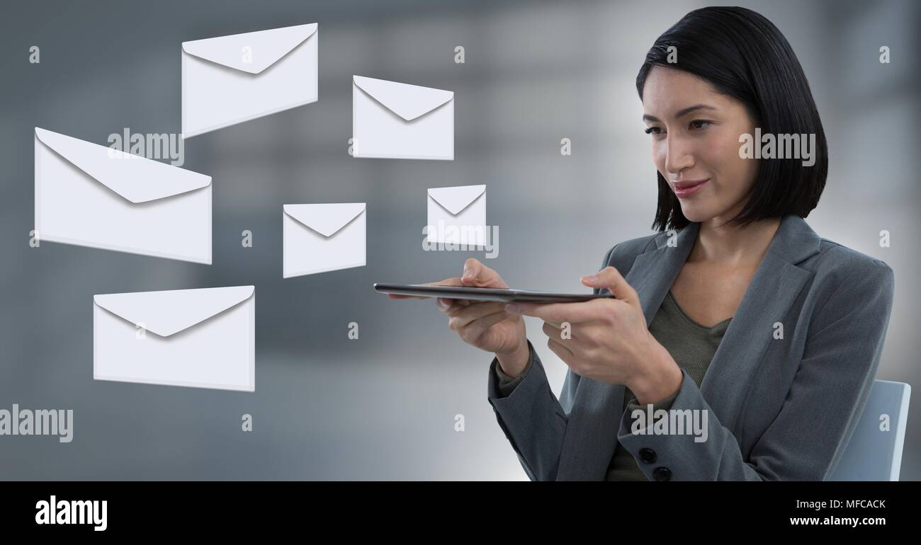 Envelope letter messages and woman using tablet Stock Photo - Alamy