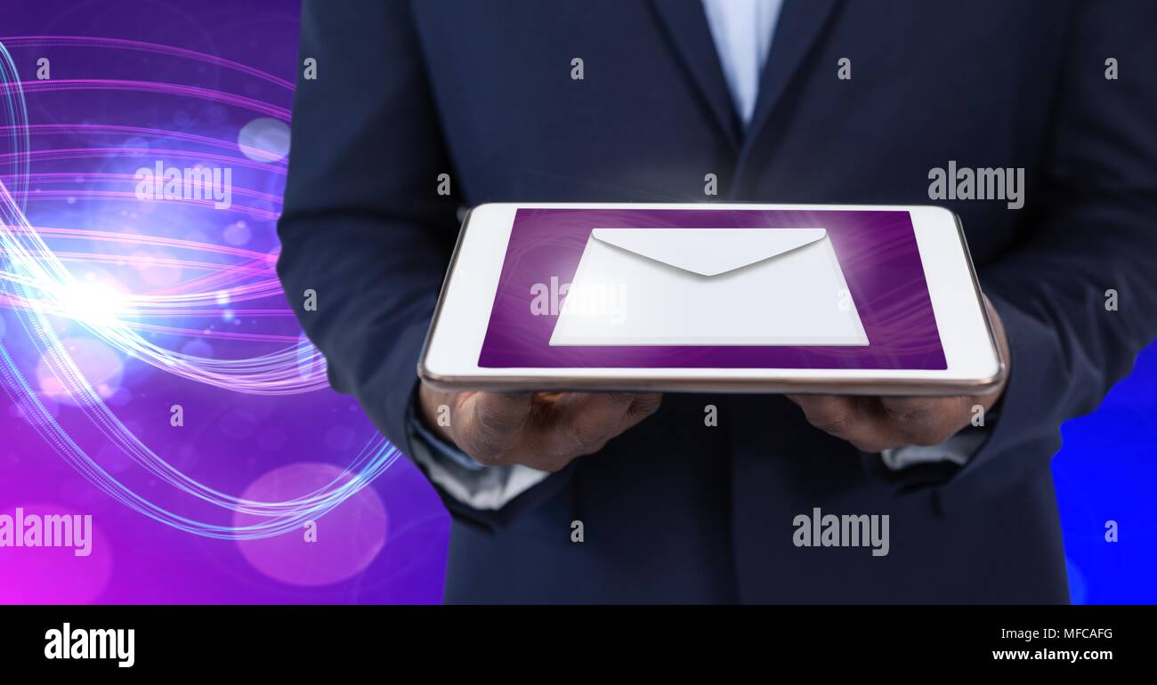 Envelope letter message and man using tablet Stock Photo - Alamy