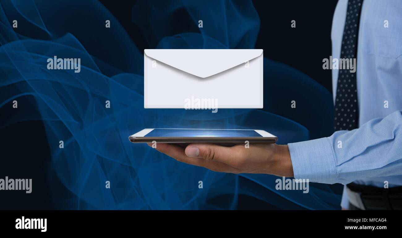 Envelope letter message and man using tablet Stock Photo - Alamy