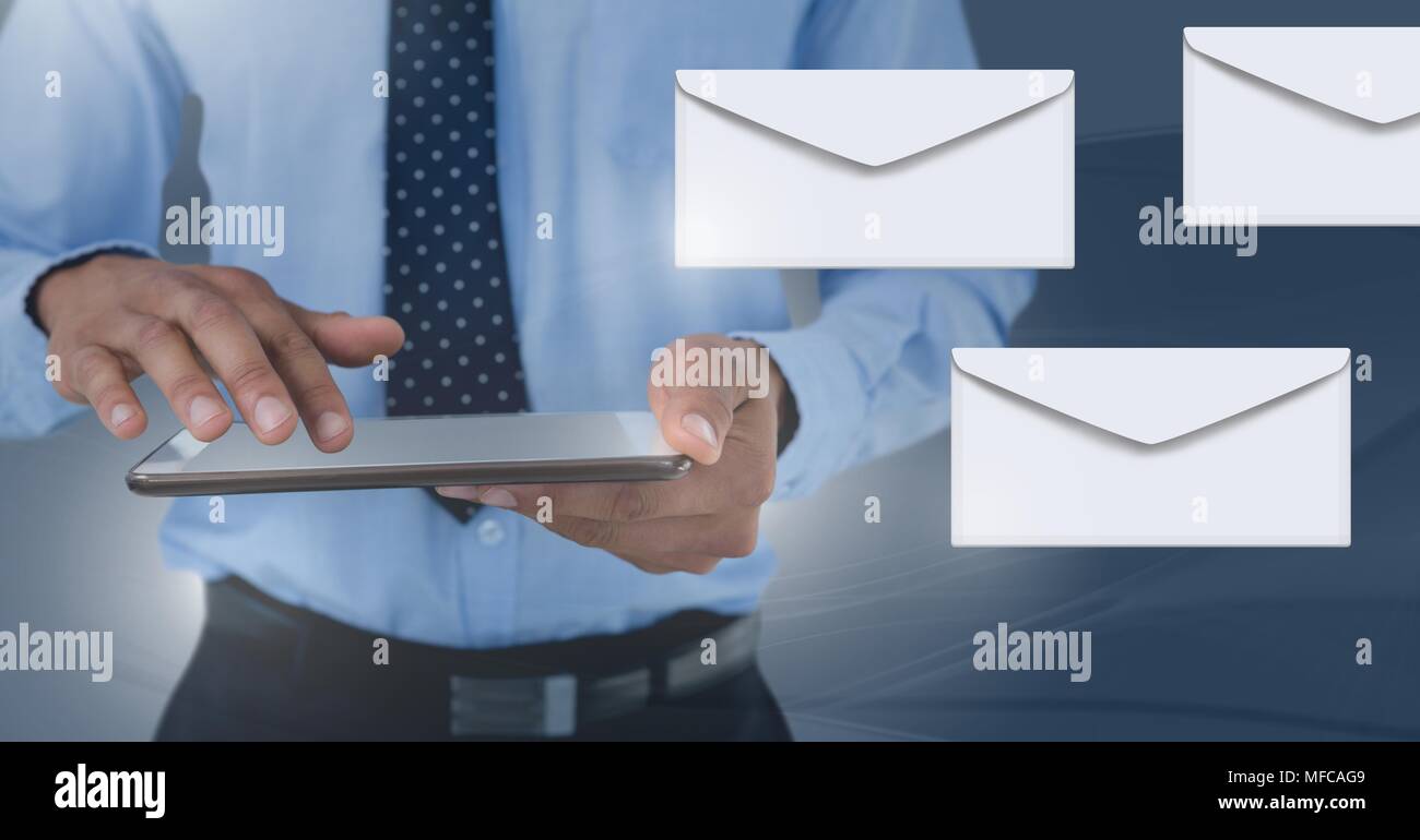 Envelope letter messages and man using tablet Stock Photo - Alamy