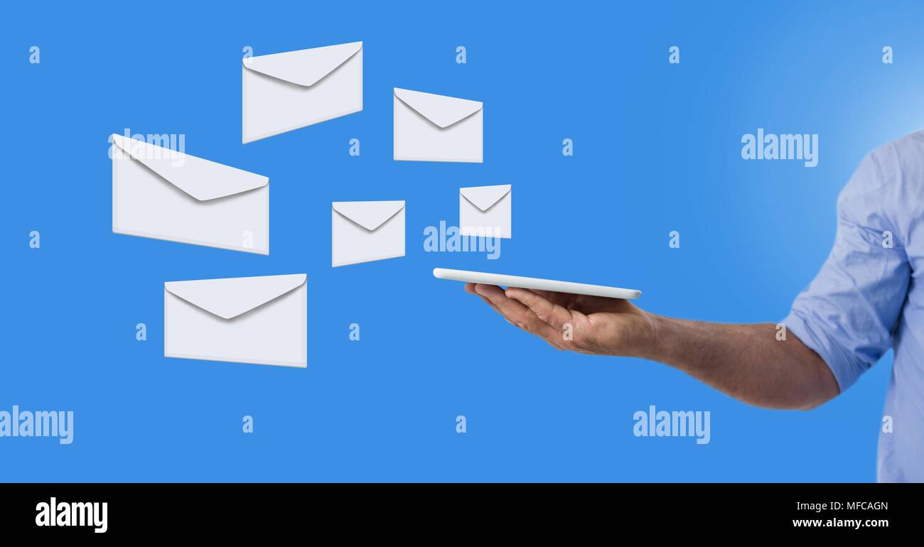 Envelope letter messages and man using tablet Stock Photo - Alamy