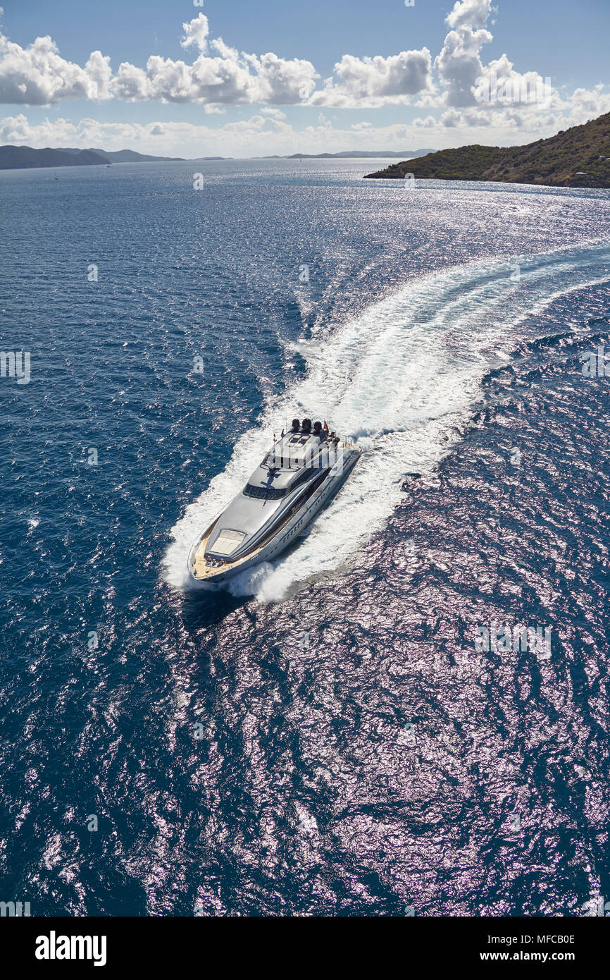Aerial view of powerboat at sea with islands and wake Stock Photo - Alamy