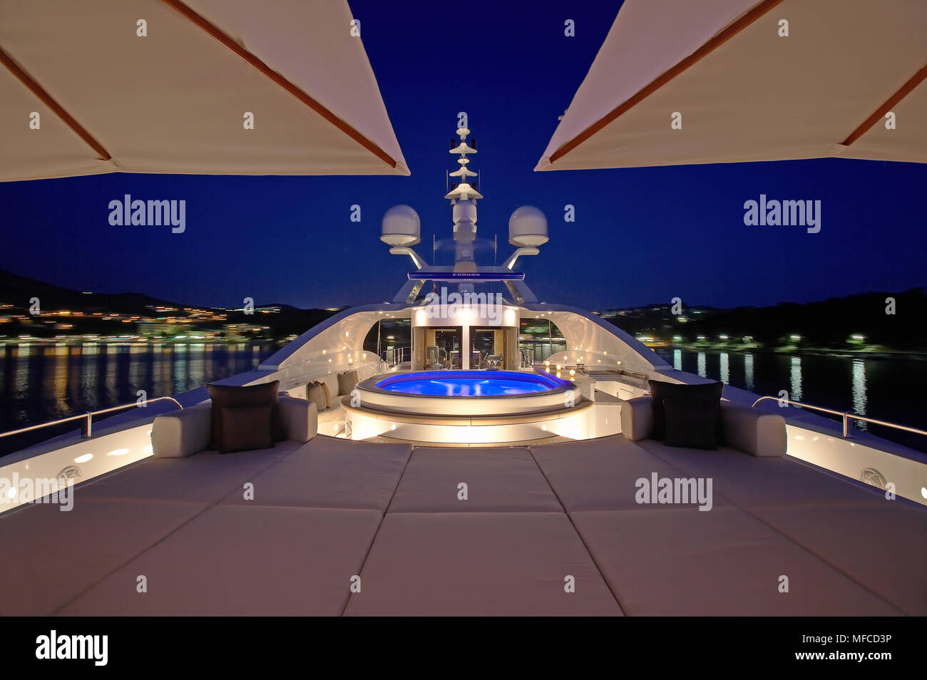 Superyacht sundeck with jacuzzi at night Stock Photo - Alamy