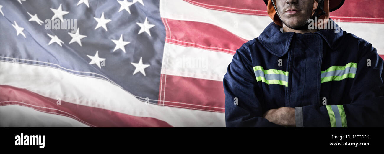 Composite image of serious fireman with arms crossed Stock Photo - Alamy