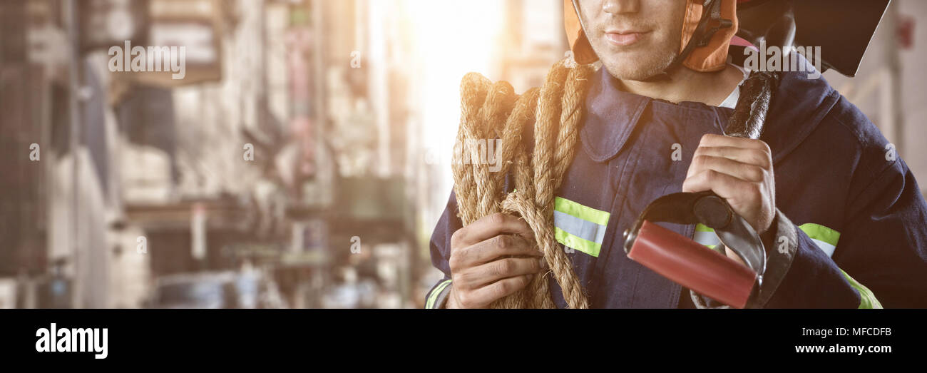 Composite image of professional fireman Stock Photo - Alamy