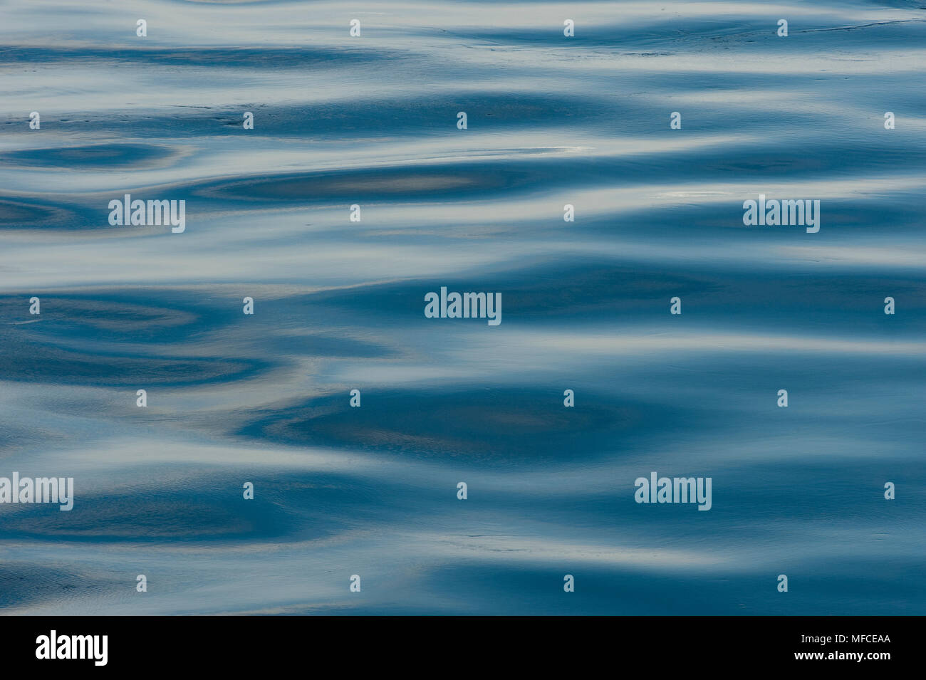 Ripples in ocean behind ship Stock Photo - Alamy