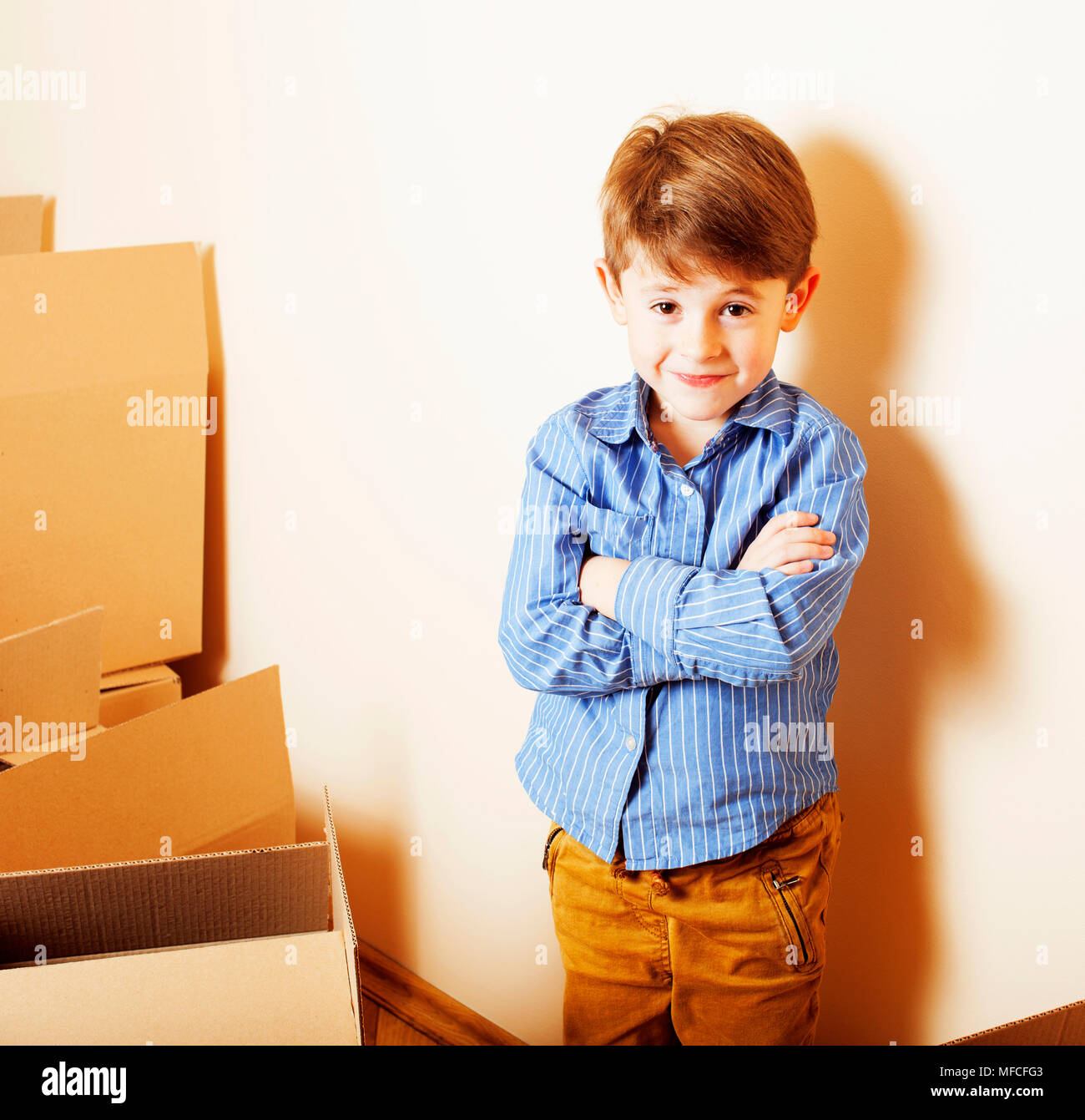 little cute boy in empty room, remoove to new house. home alone Stock ...