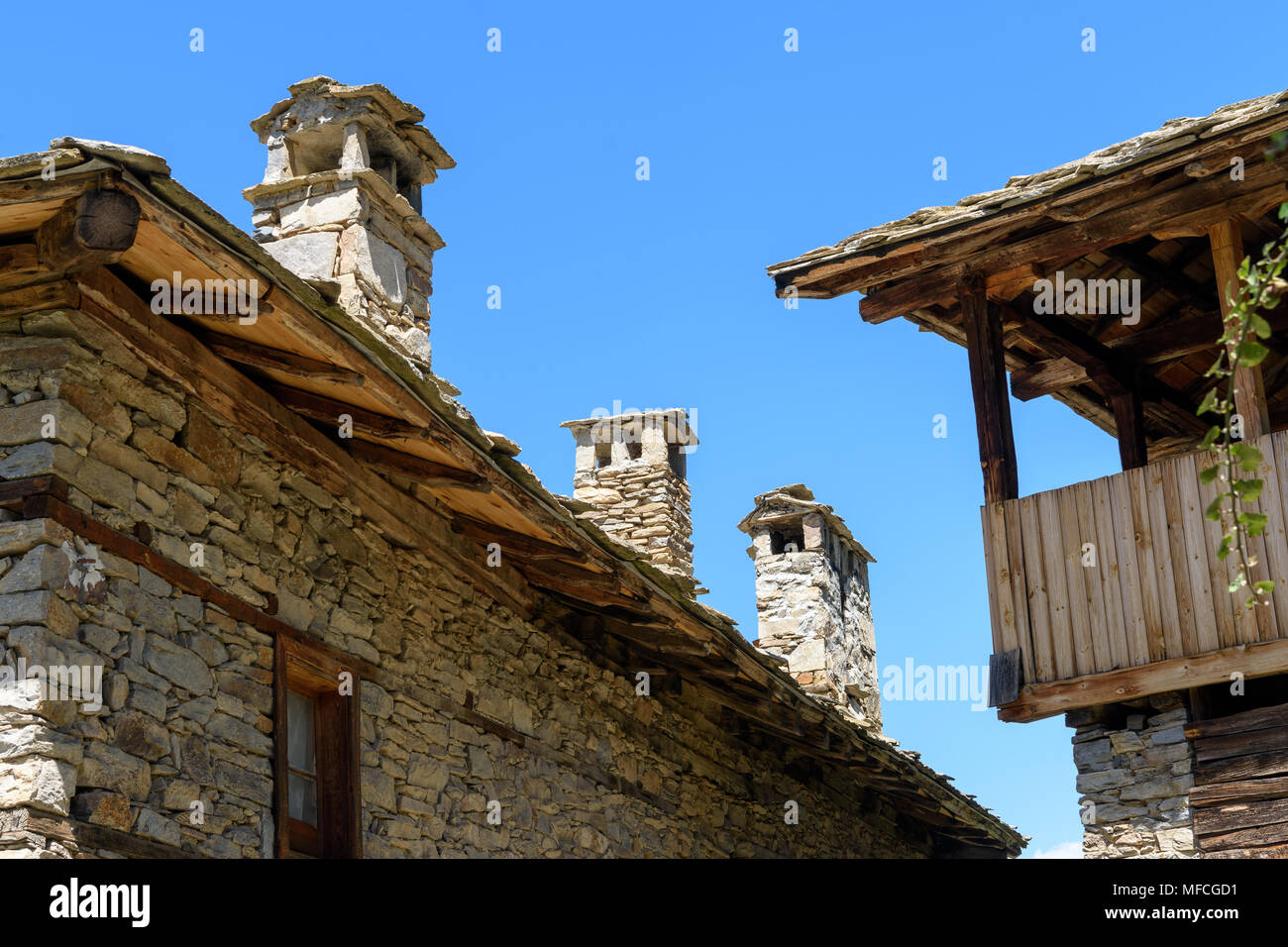 Old authentic rustic houses made of stone bricks and stone slate roofs ...