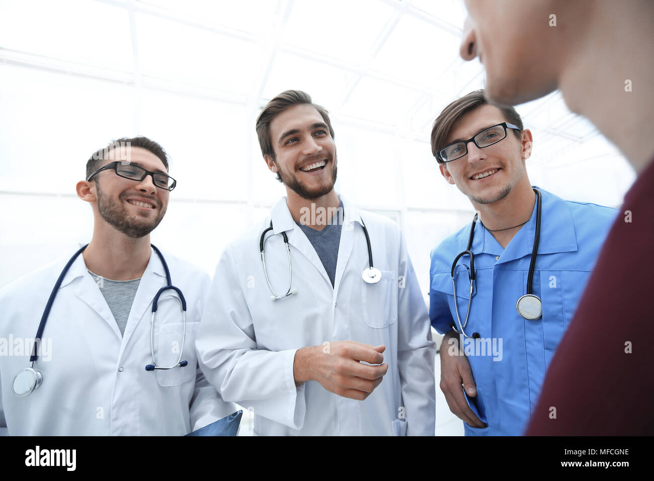 group of doctors advising the patient Stock Photo - Alamy