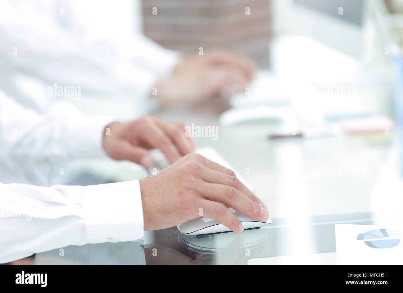 hands typing text on the computer keyboard. blurred business background ...