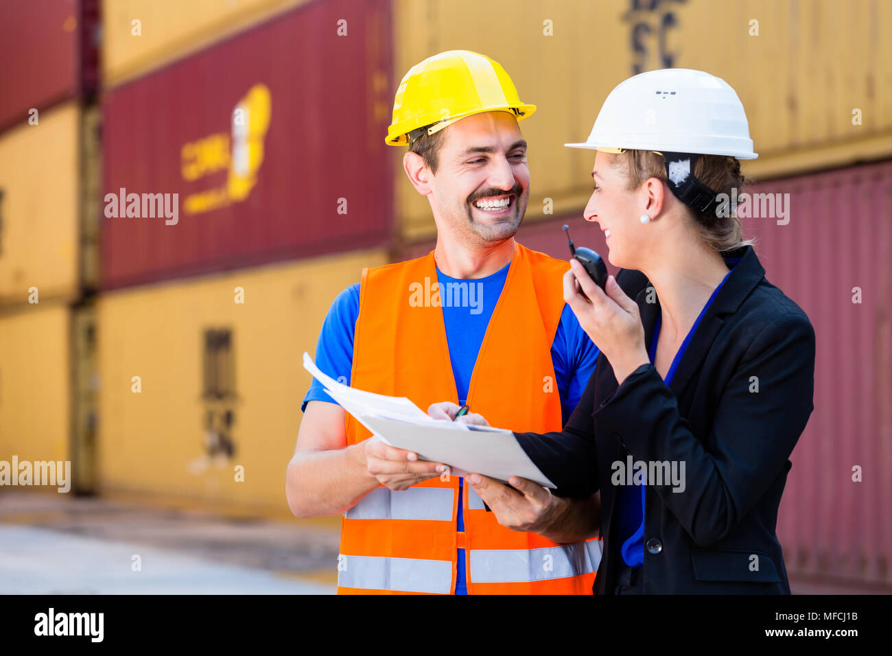 workers in logistics company discussing documents Stock Photo - Alamy