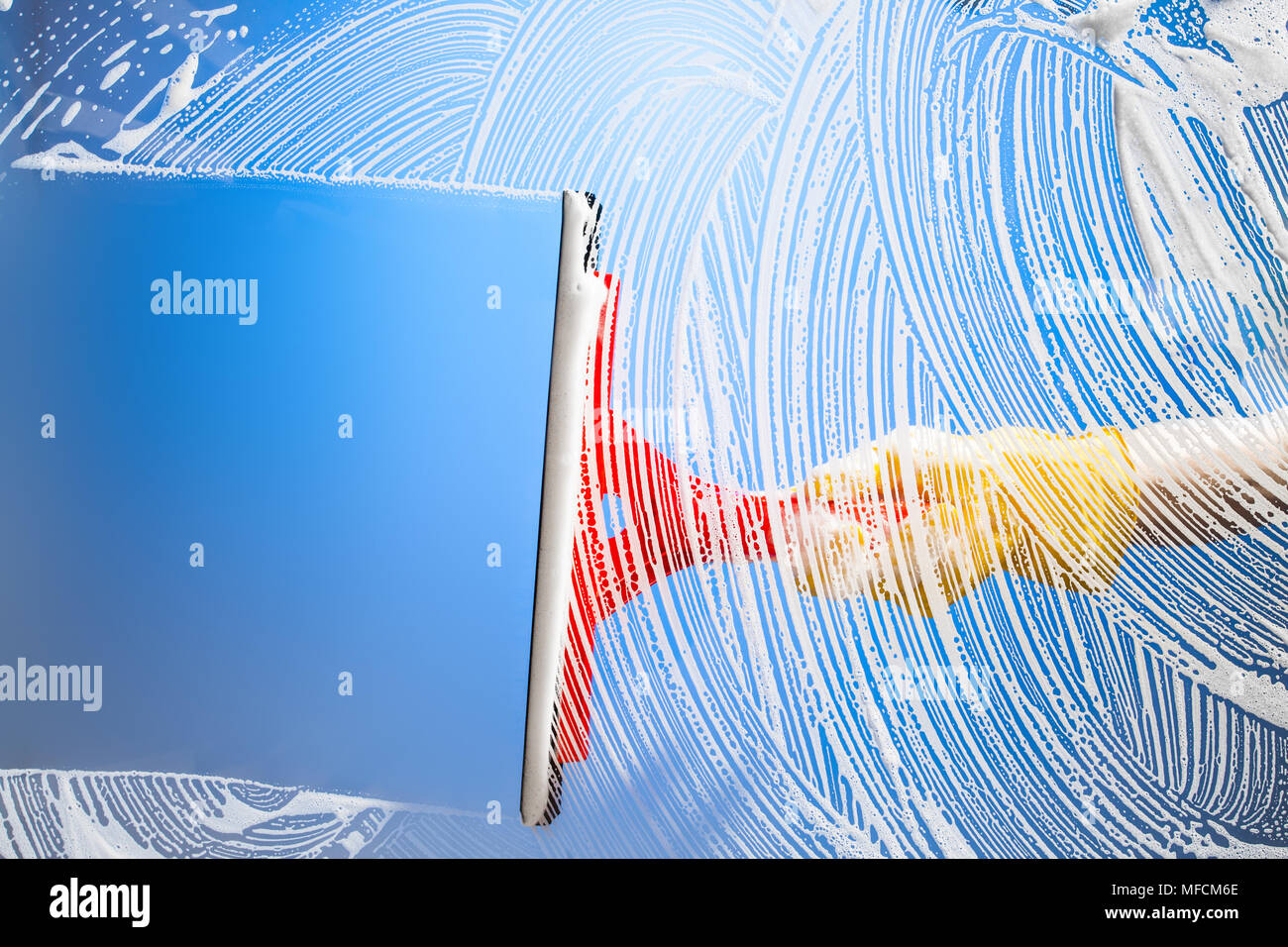 cleaning window with squeegee blue sky Stock Photo - Alamy