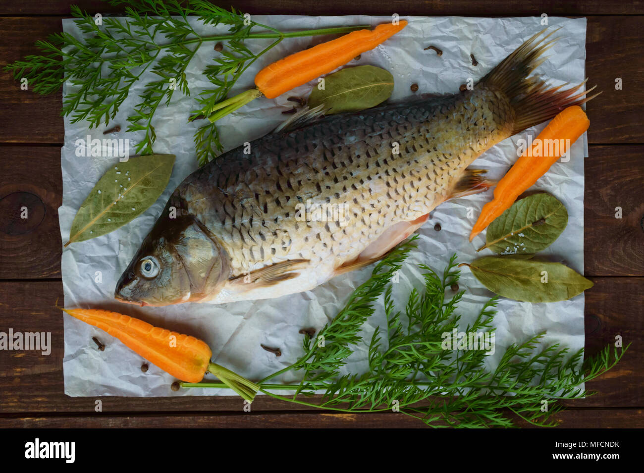 River fish - bream with spices on a wooden background. The top view ...