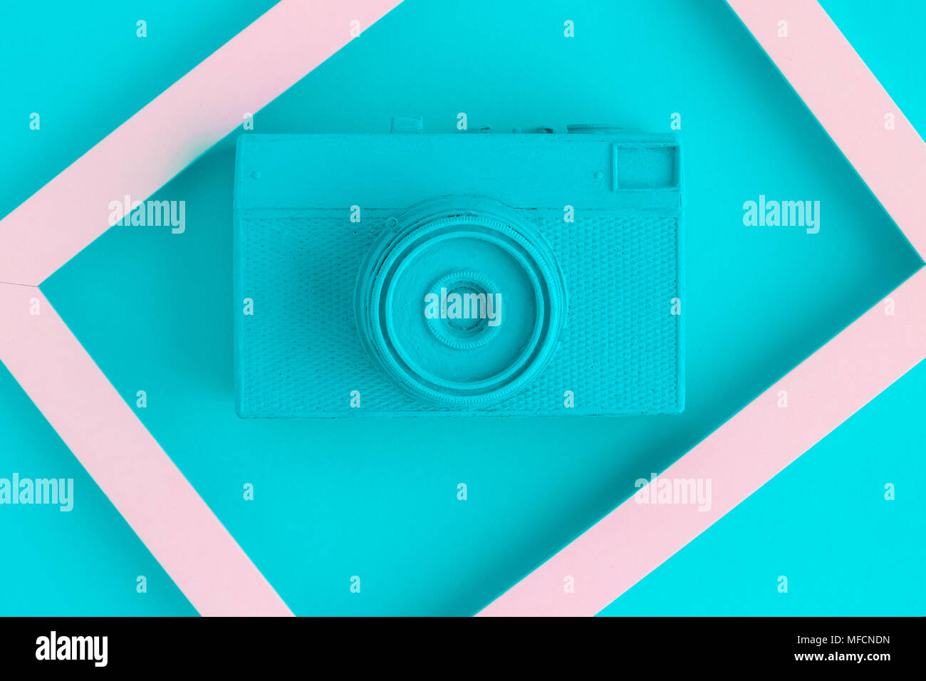 Retro film photo camera colored in turquoise with photo frame minimal ...