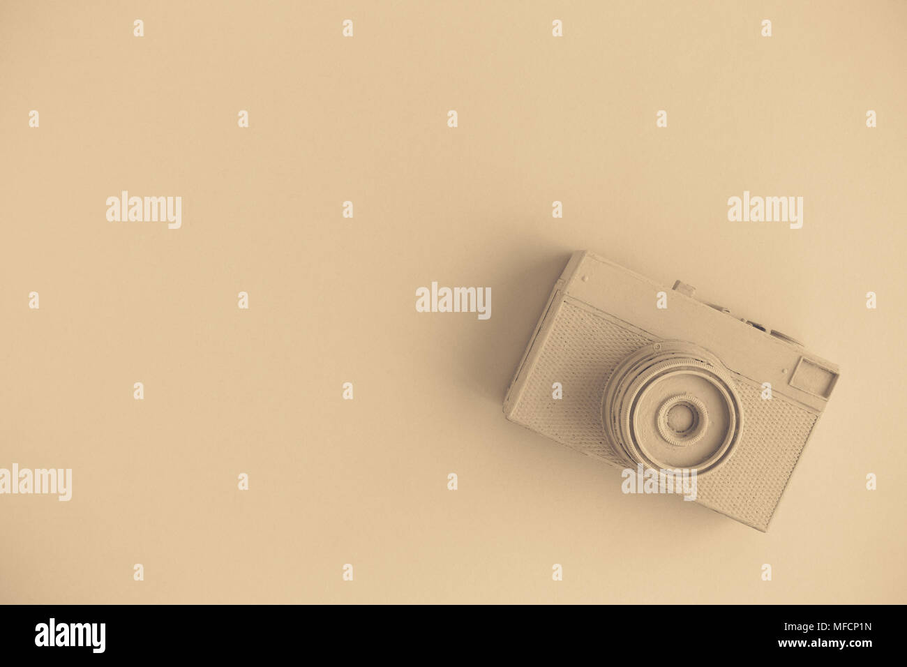 Vintage camera on background in pastel beige color minimal creative art ...