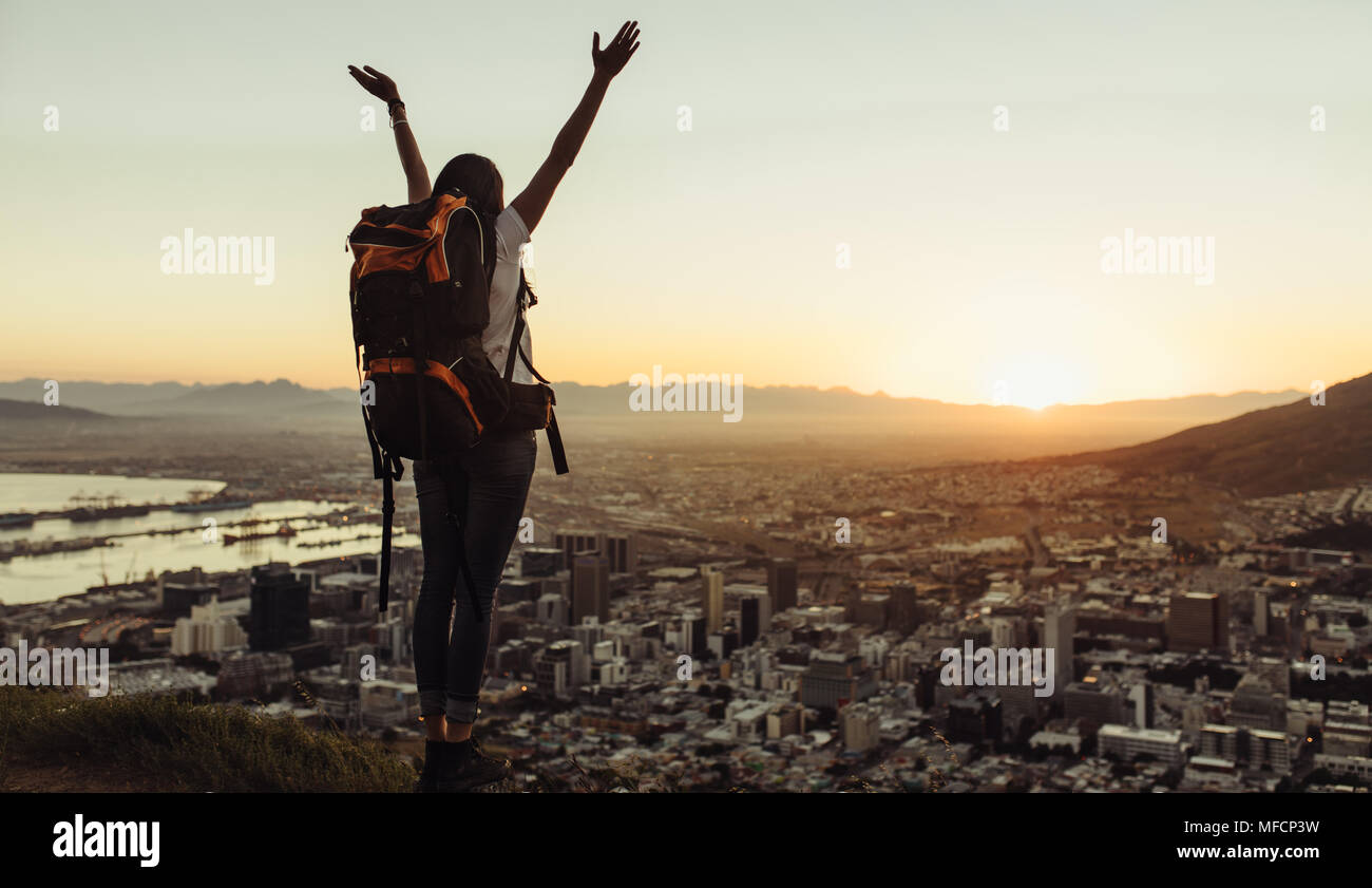 Woman arms raised rear view sky hi-res stock photography and images - Alamy