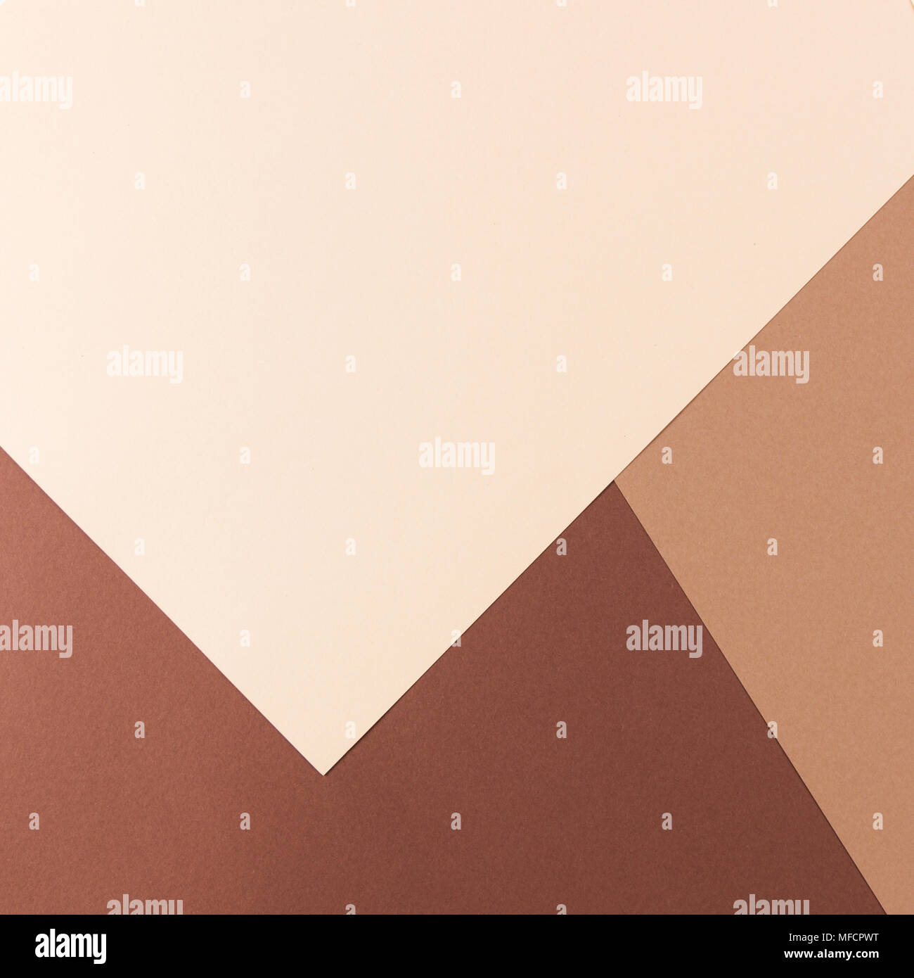 Color papers geometry composition background with pink, beige and brown ...