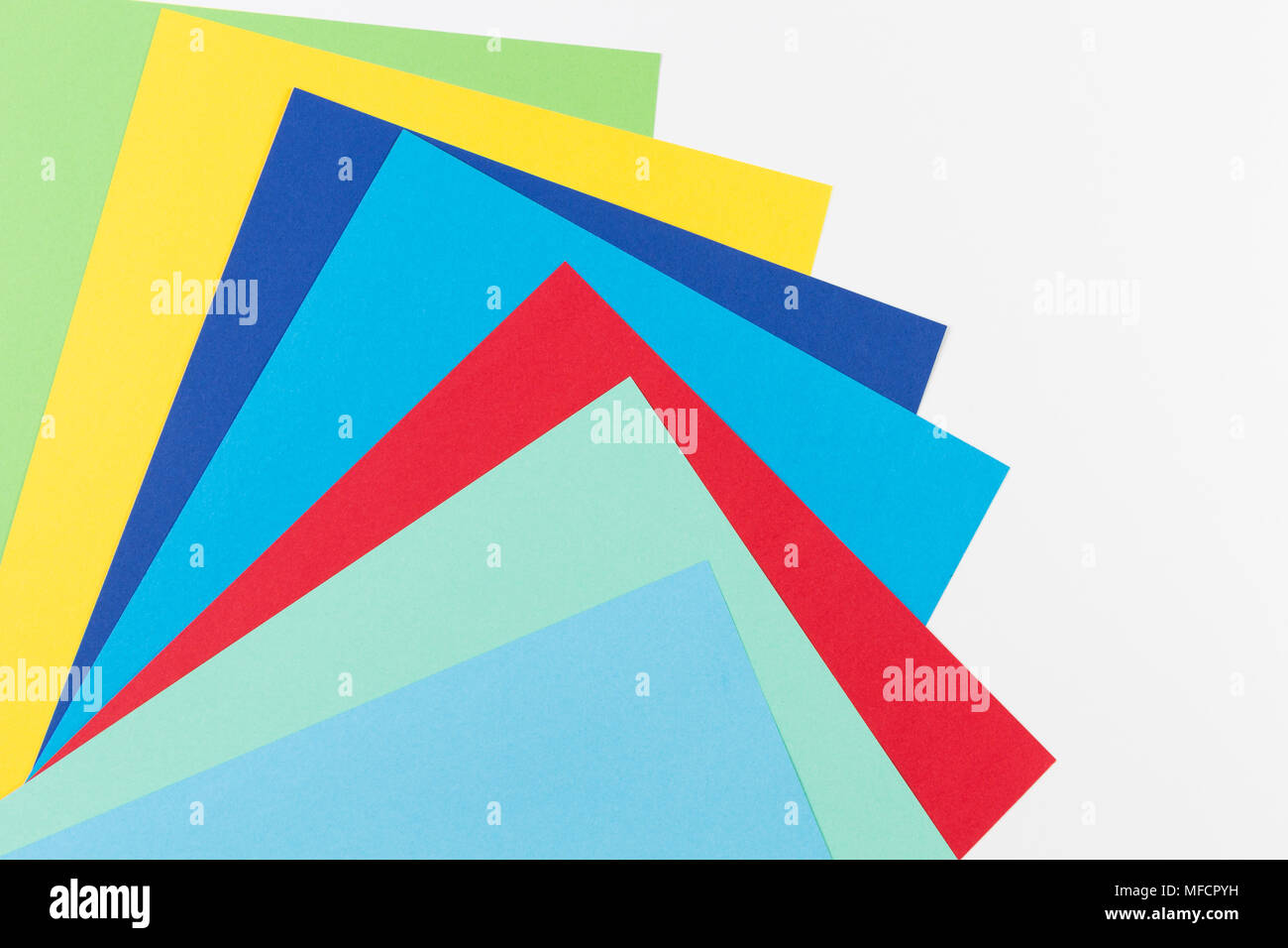 Colored paper on white background Stock Photo - Alamy