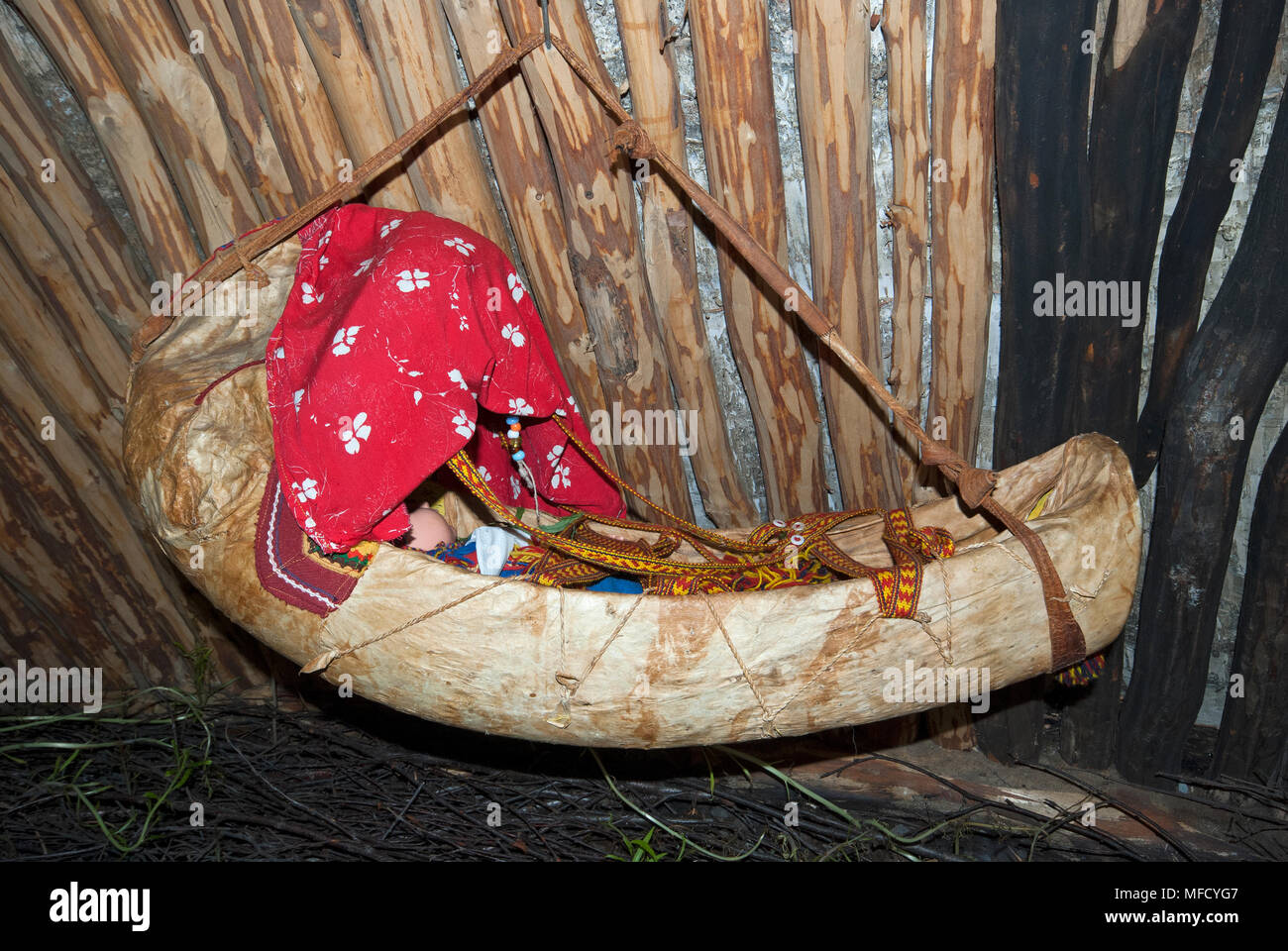 Sami wooden cradle hung in Sami Museum (Nutti Sami Siida), Jukkasjarvi ...