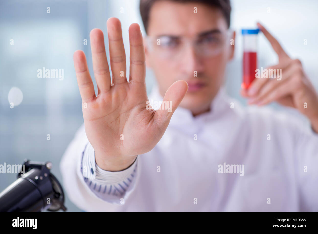Man doctor checking blood samples in lab Stock Photo - Alamy