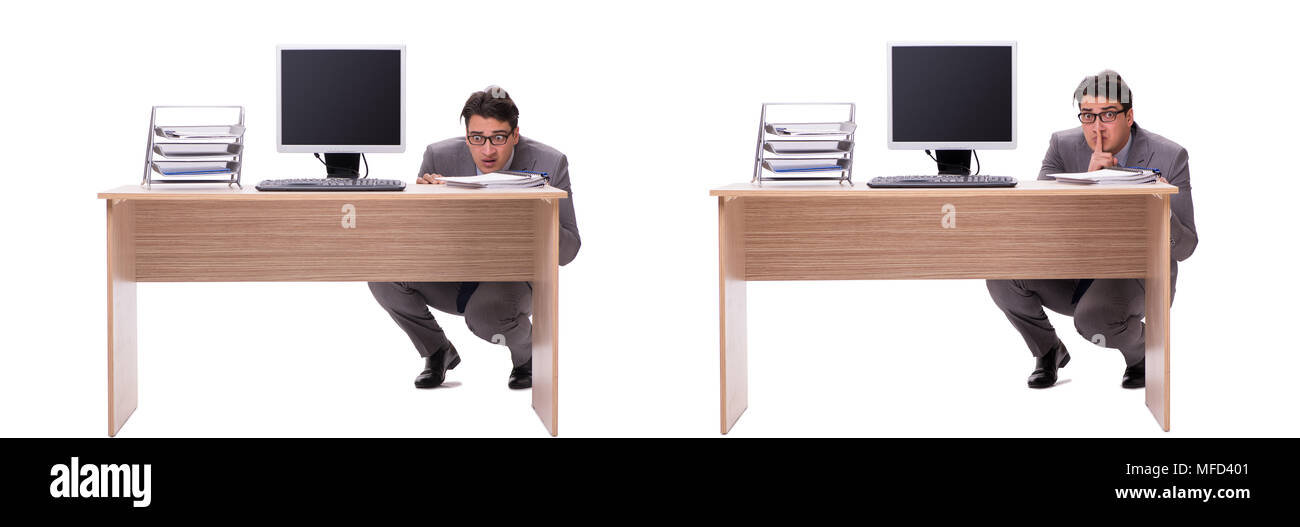 Businessman hiding in the office isolated on white Stock Photo - Alamy