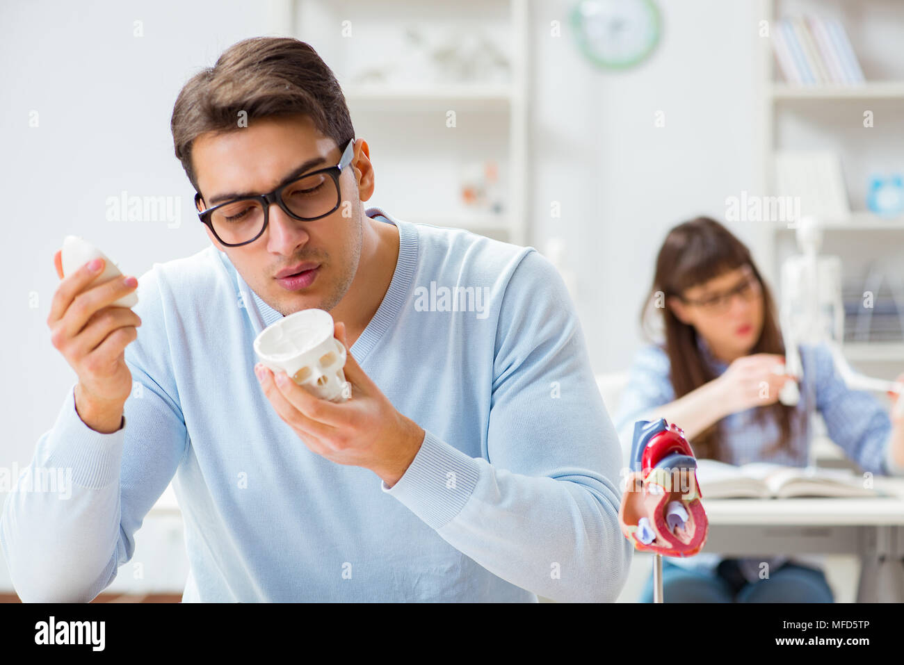 Two medical students studying in classroom Stock Photo - Alamy