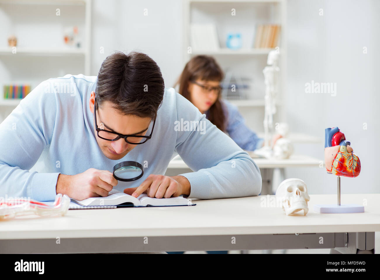 Two medical students studying in classroom Stock Photo - Alamy