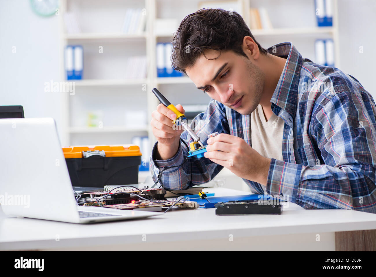 Computer hardware repair and fixing concept by experienced technician ...