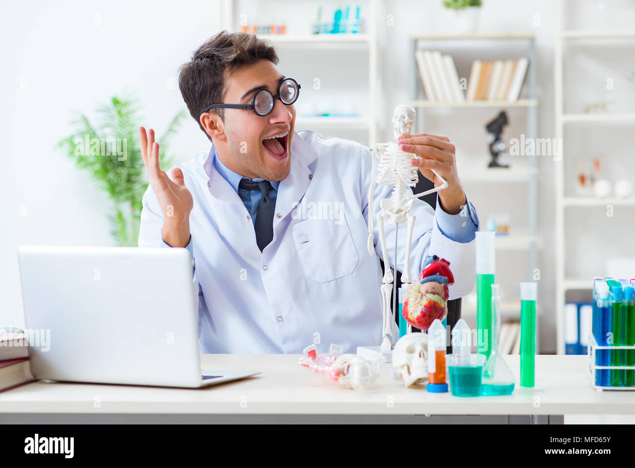 Funny doctor having fun in hospital lab Stock Photo - Alamy