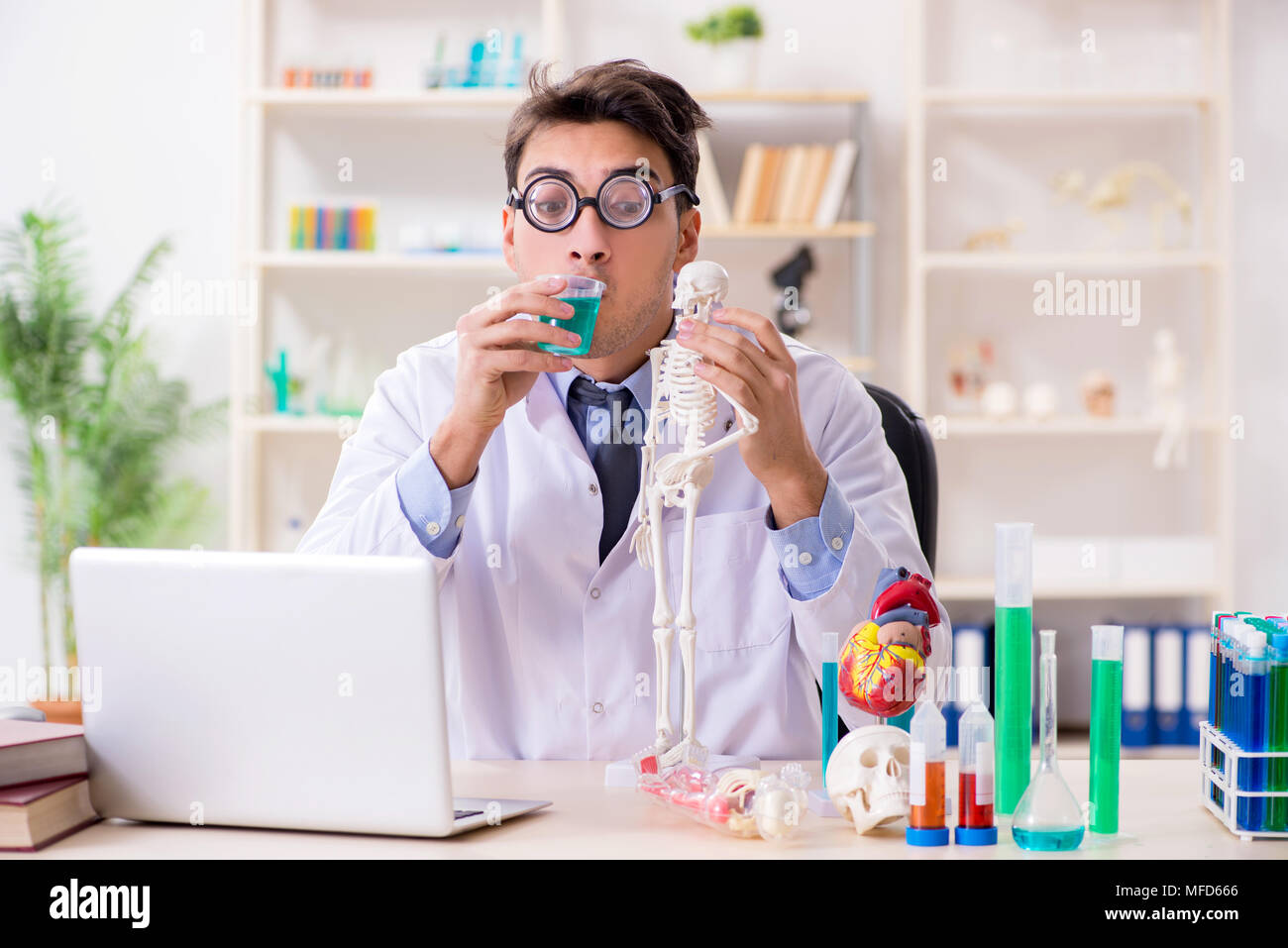 Funny doctor having fun in hospital lab Stock Photo - Alamy