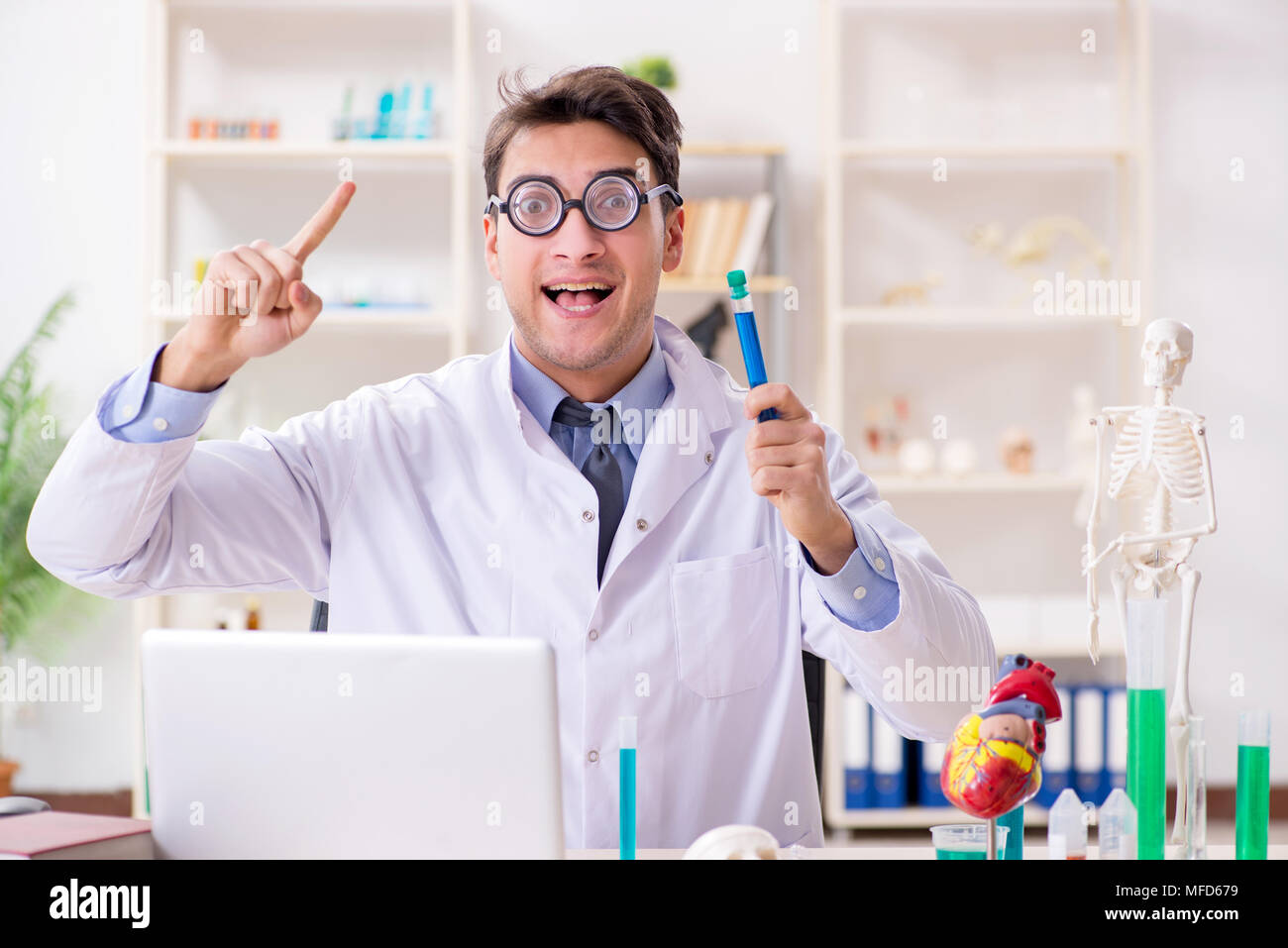 Funny doctor having fun in hospital lab Stock Photo - Alamy