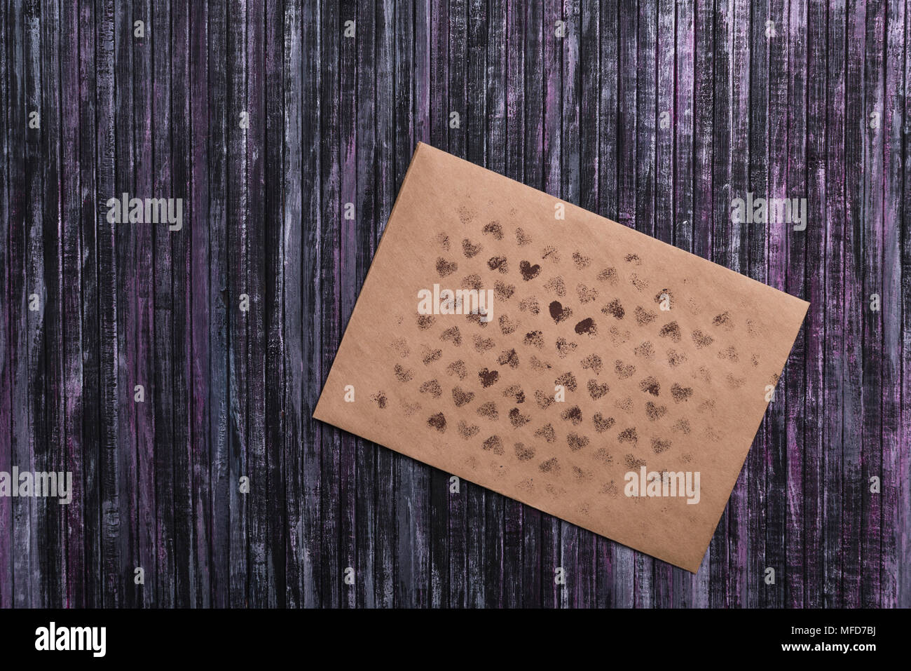 Envelope of Kraft paper. Love letter envelope. Wooden background ...