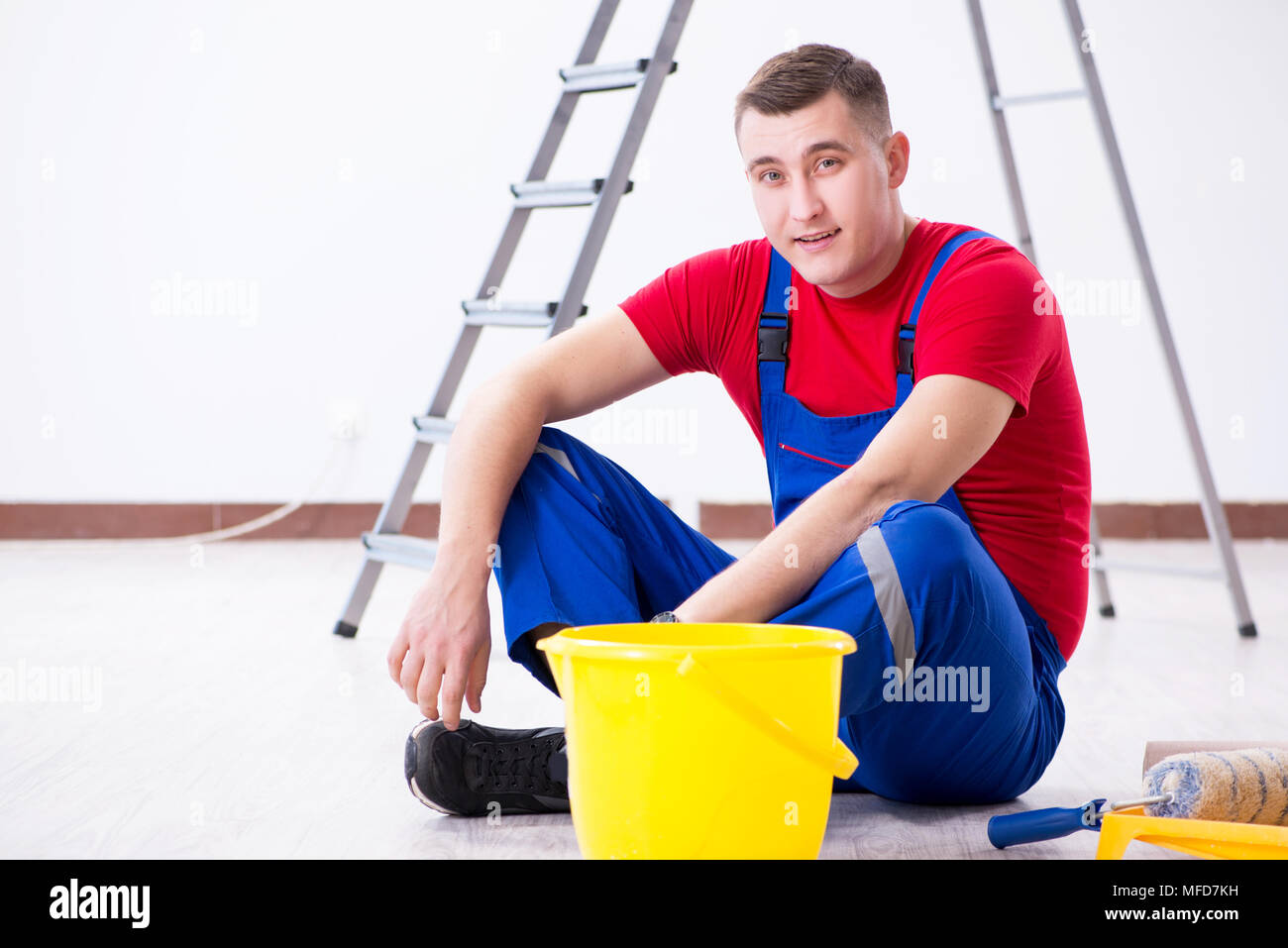 Male painter preparing for painting job at construction site Stock ...