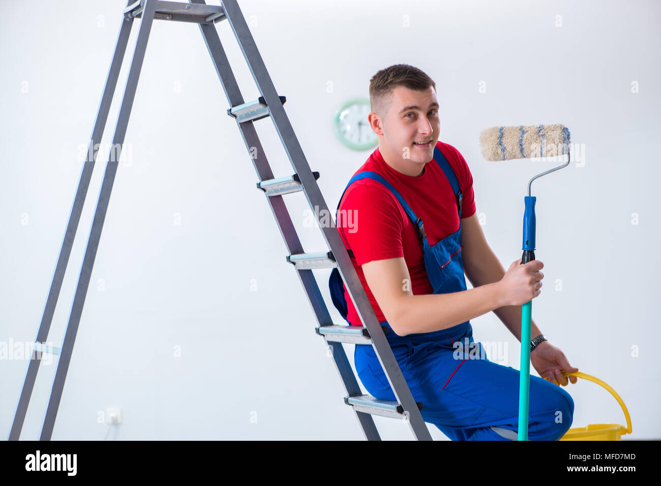 Male painter preparing for painting job at construction site Stock ...