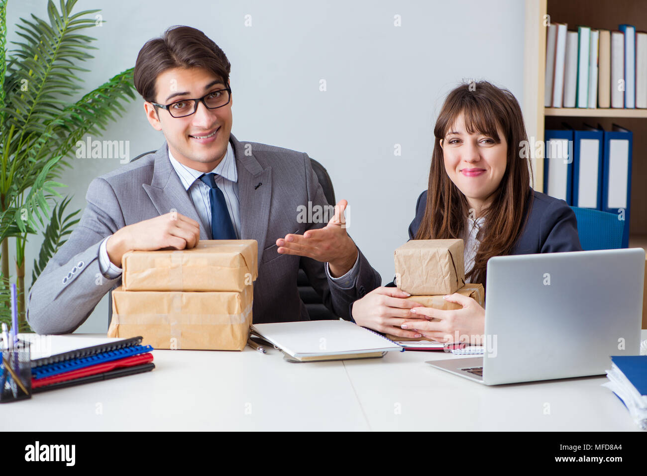 Business people receiving new mail and parcels Stock Photo - Alamy