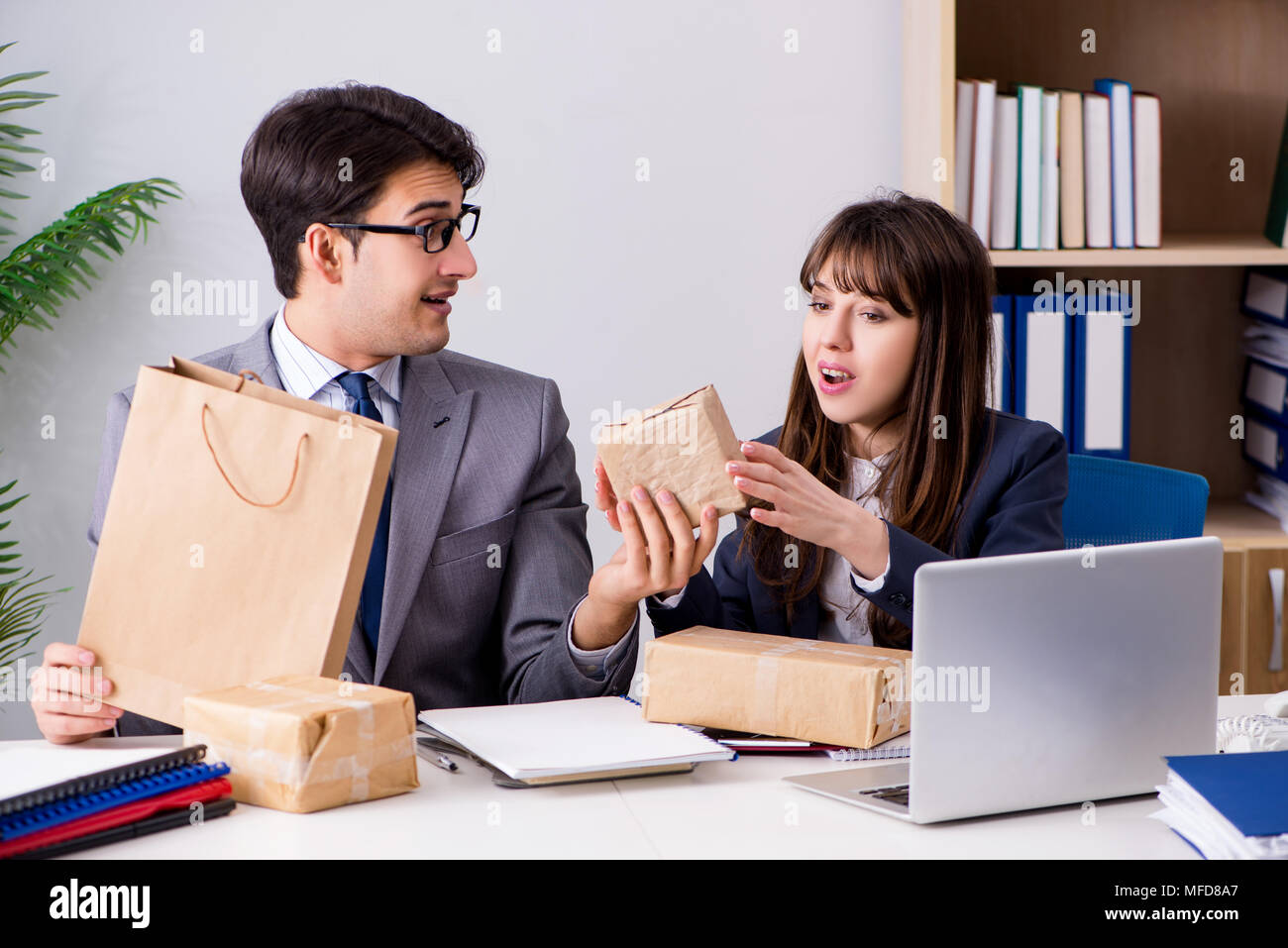Business people receiving new mail and parcels Stock Photo - Alamy