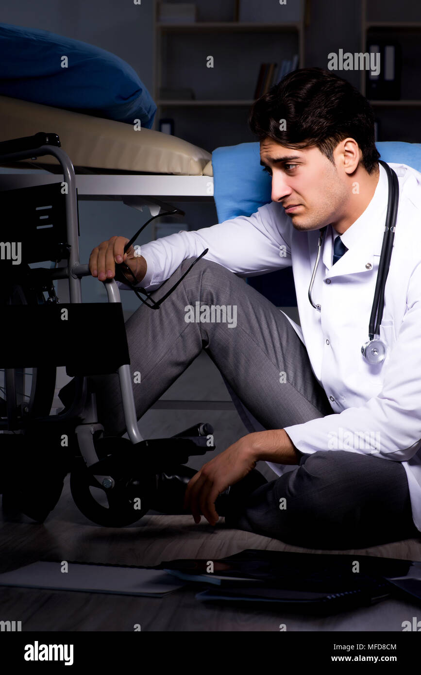 Doctor working night shift in hospital after long hours Stock Photo - Alamy